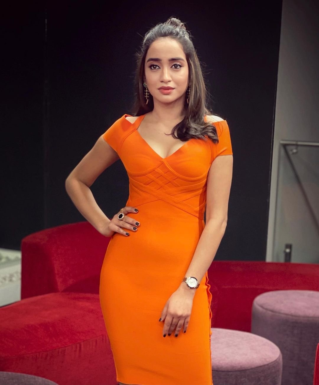 Anchor Vindhya Hot Pics In Orange Dress