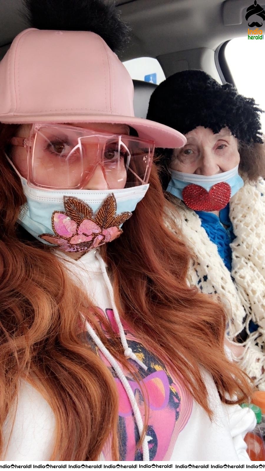 Phoebe Price shows her midriff and wears a mask due to Coro