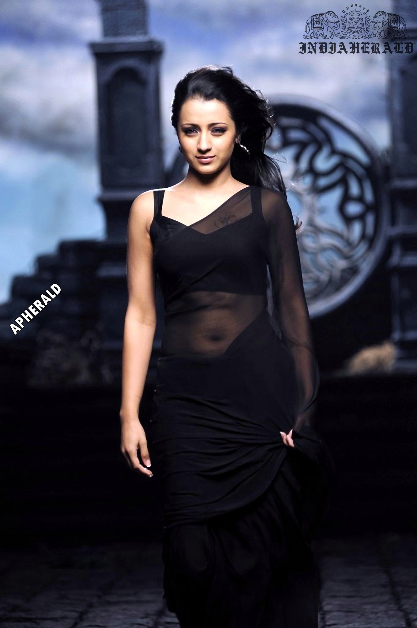 Trisha tempts our mood by exposing her navel and waist in B