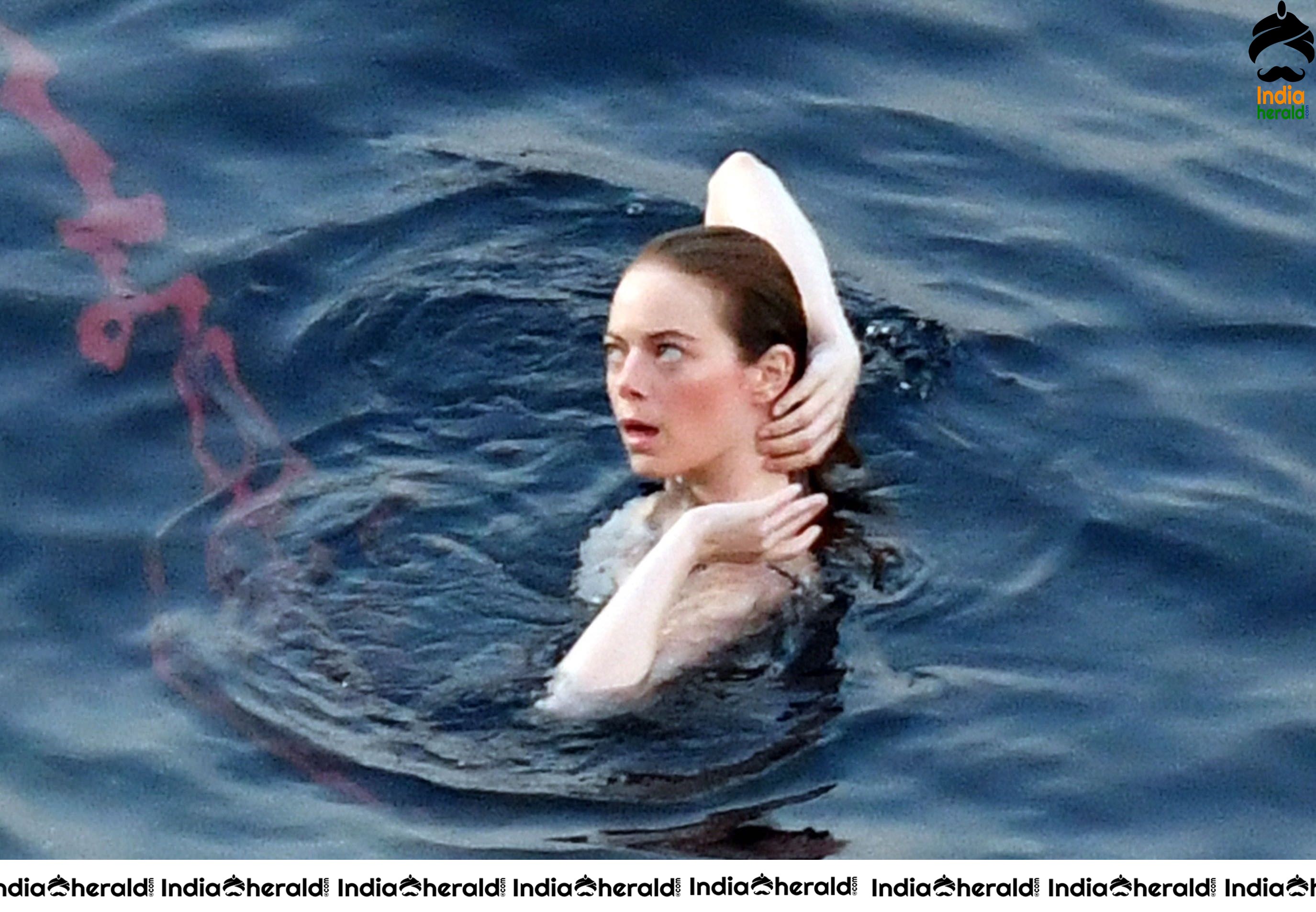 Emma Stone in Single Piece Bikini shooting an advertisement