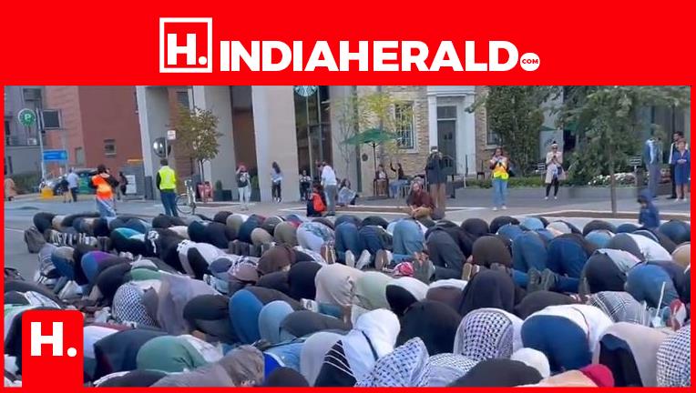 Muslims block traffic and pray in the middle of the road in