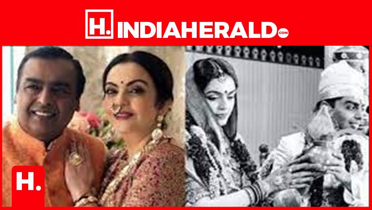 Nita-Mukesh Ambani hand-in-hand gold casting...