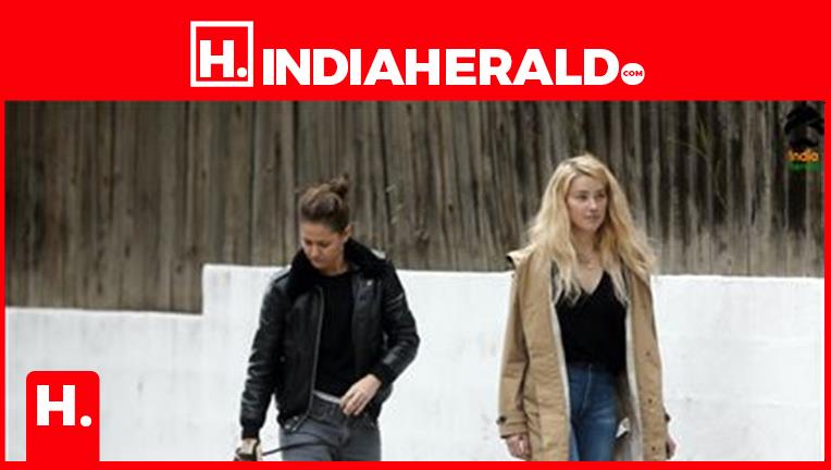 Amber Heard takes a break from isolation to walk Birdie wit