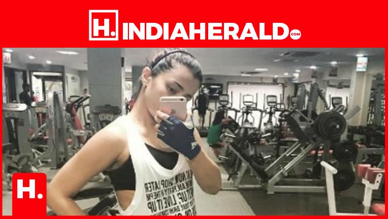 Trisha shaping her body in the Gym