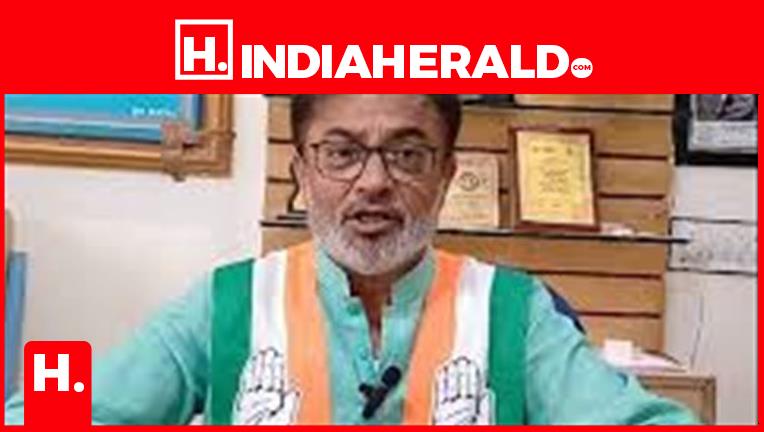 Congress candidate Lalit Vasoya asked for notes.