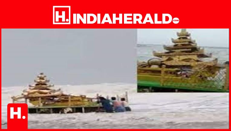 Strange Gold-plated chariot floating in the sea..